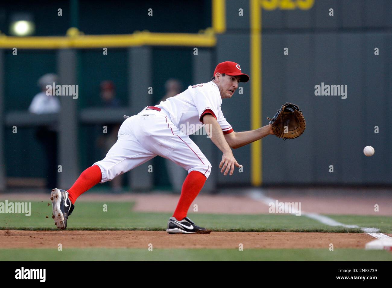 Cincinnati Reds first baseman Adam Rosales fields a ground ball in a ...