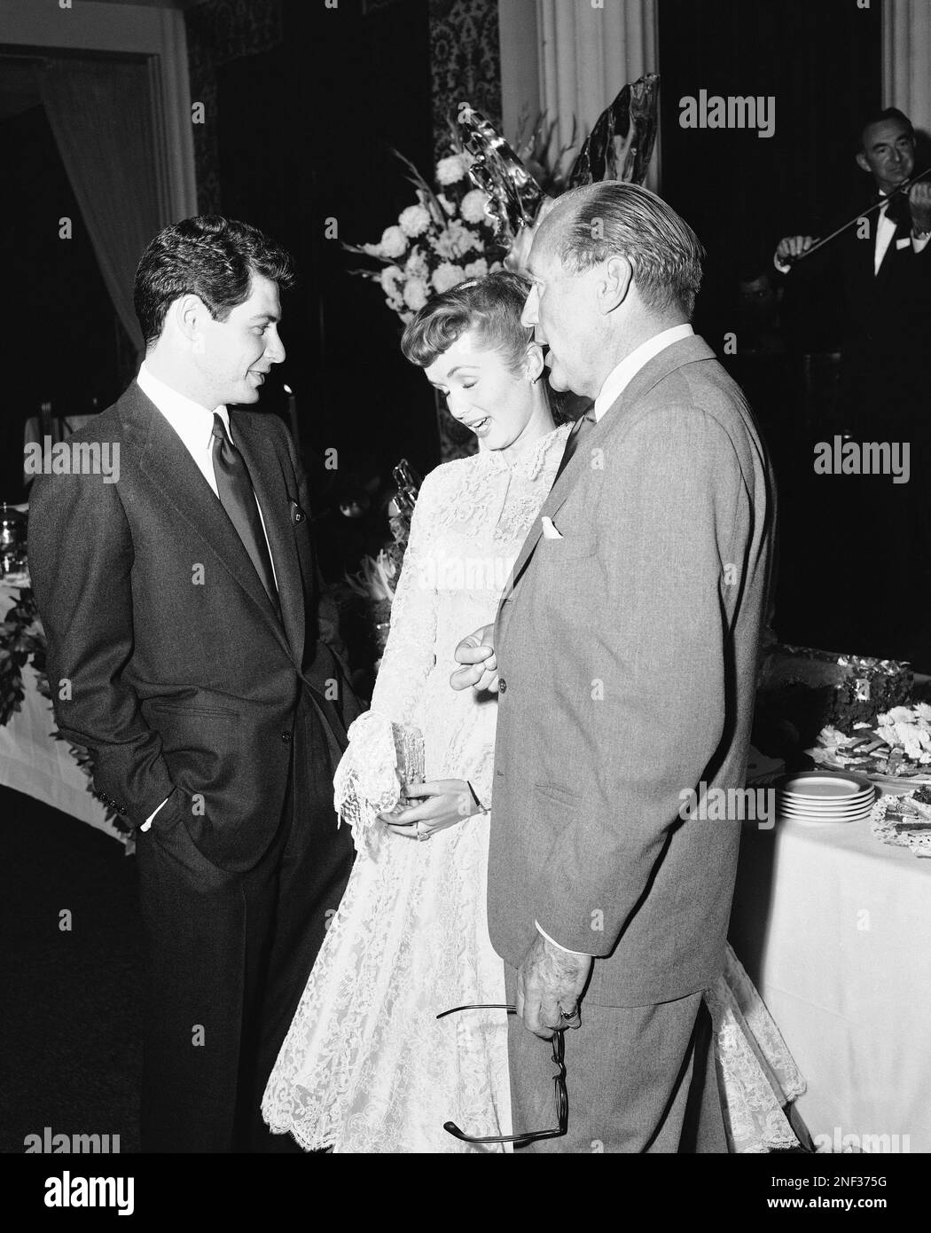 Debbie Reynolds looks coy and Eddie Fisher, left, looks proud as Jack ...