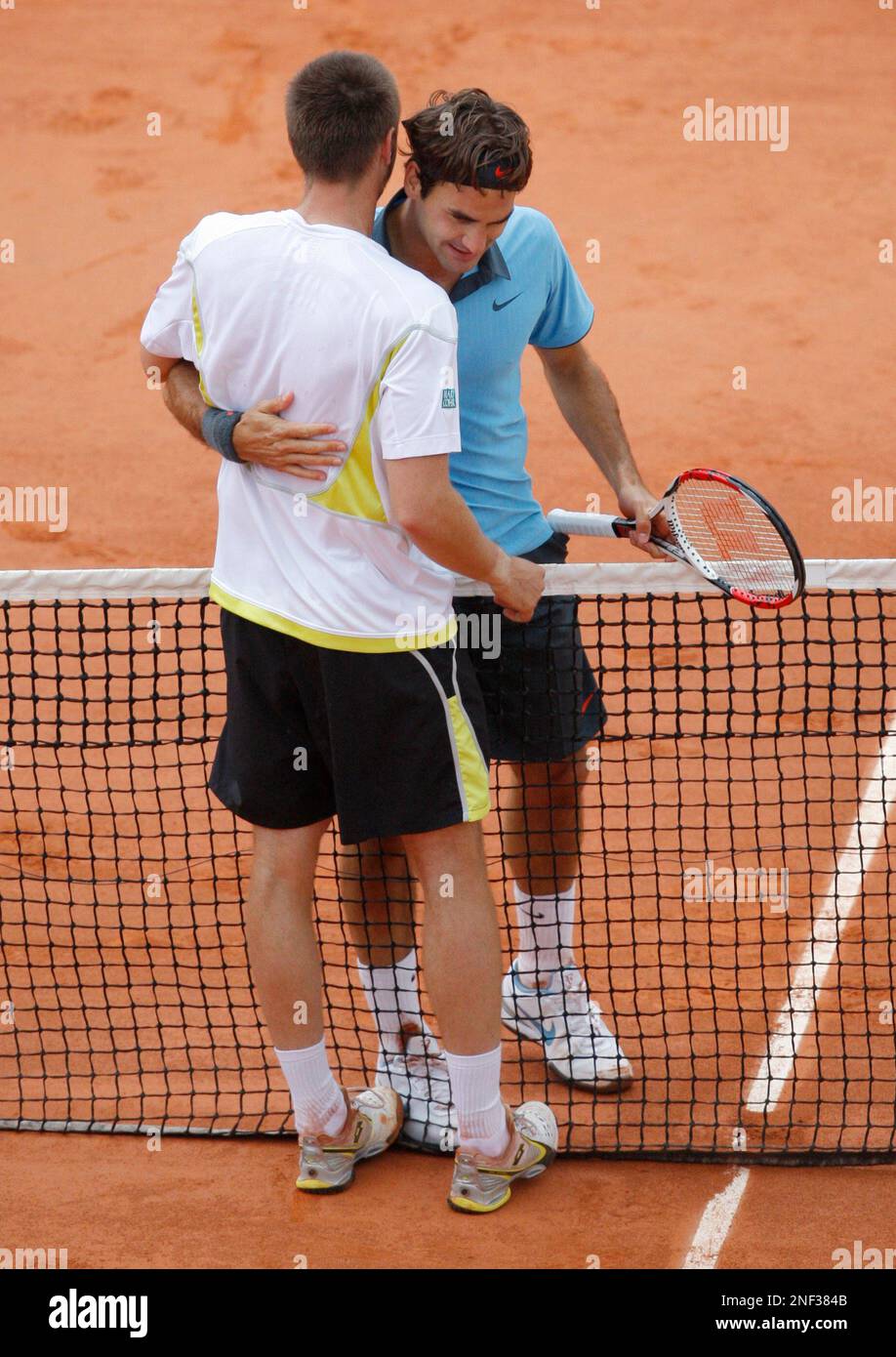 Switzerland's Roger Federer embraces Sweden's Robin Soderling after ...