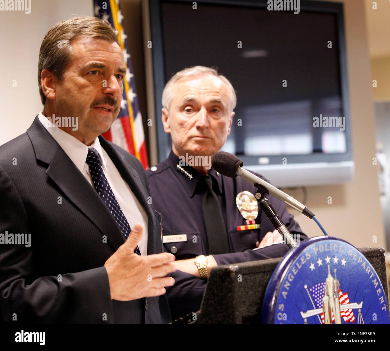 Los Angeles Police detective Charlie Beck, left, speaks during a news ...