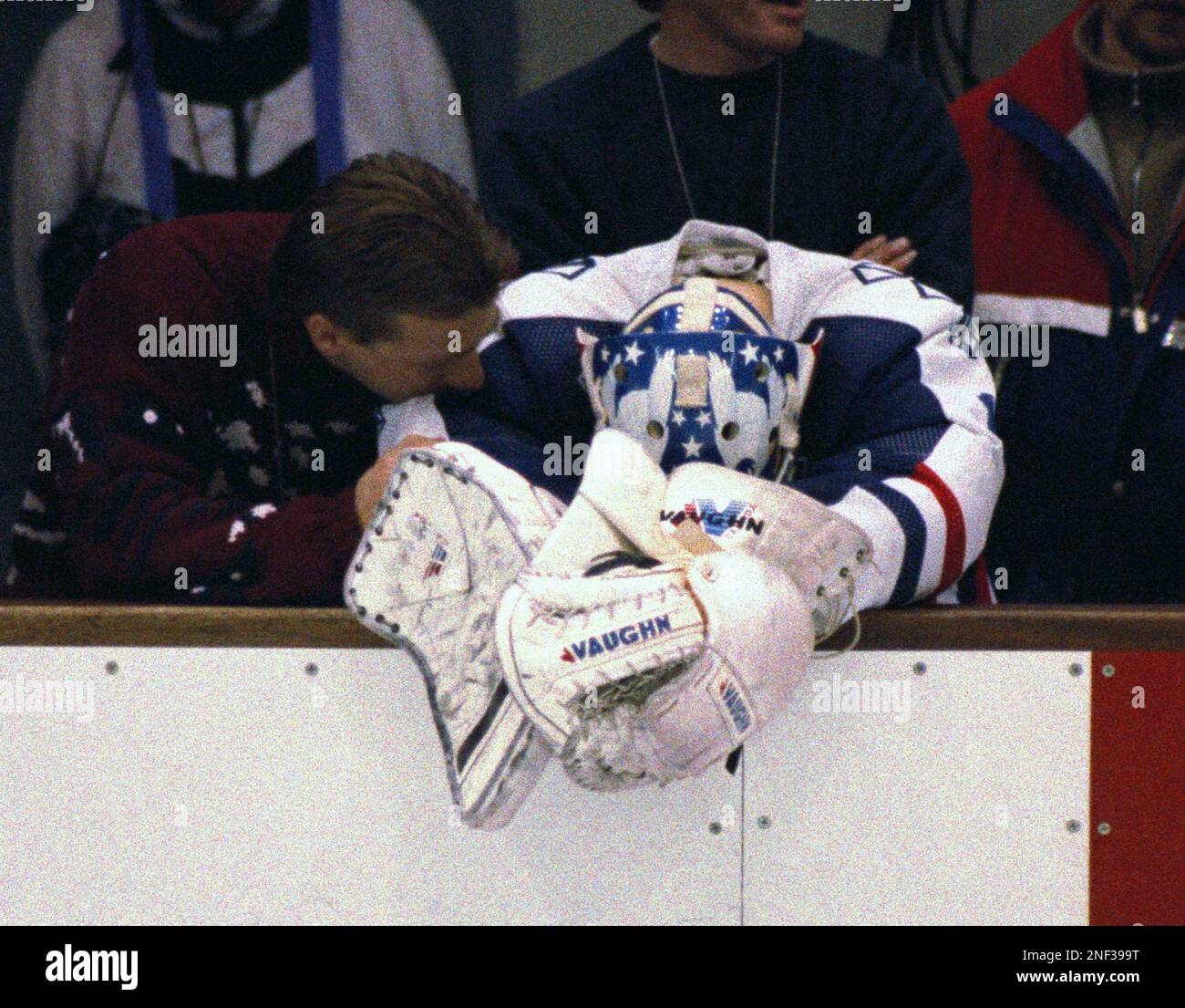U.S. goalie Ray LeBlanc, center, is comforted by a team coach after ...