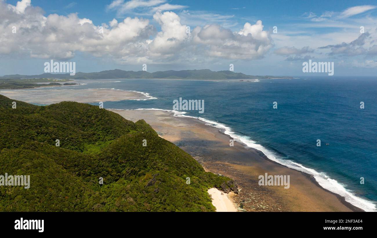Top view of tropical island coastline and blue ocean. Luzon, Santa Ana ...