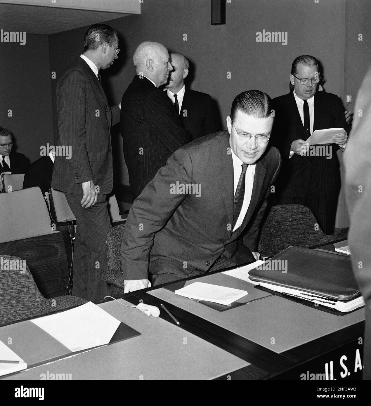 Secretary of Defense of the United States Robert McNamara, center, is ...