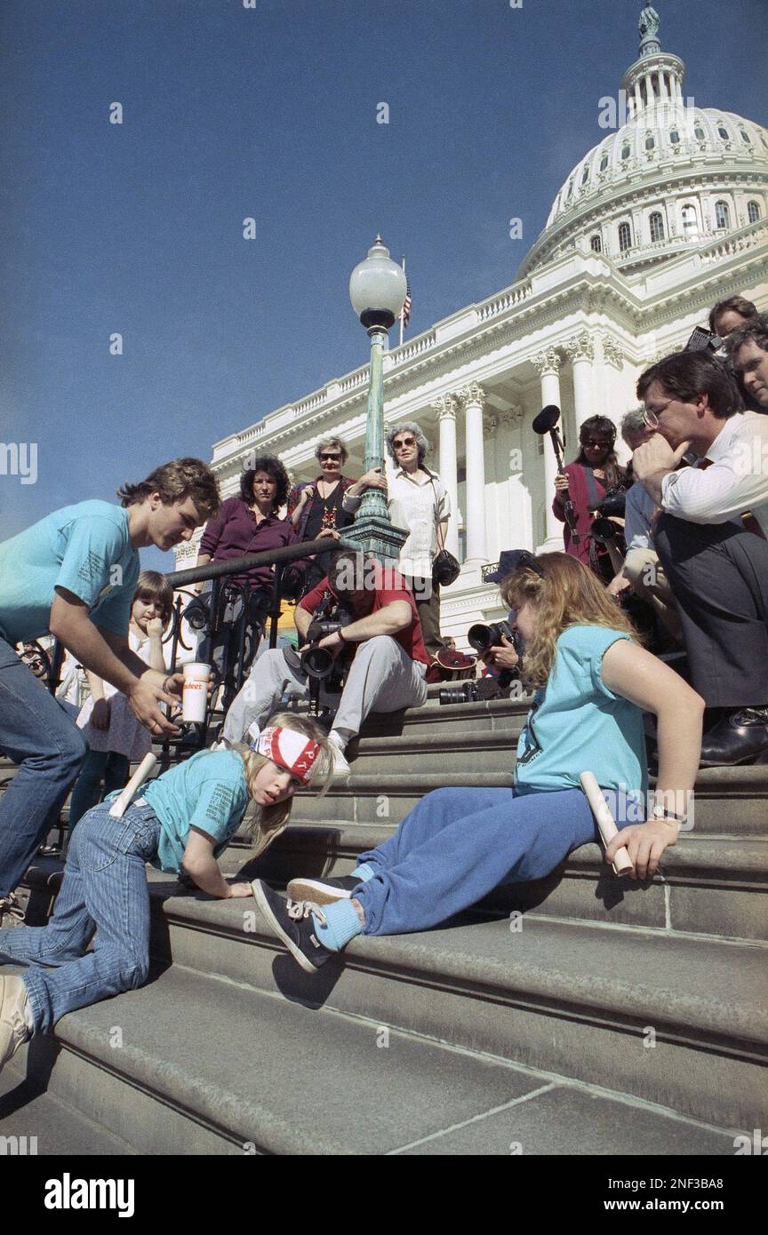 A group of handicapped people led by 8-year-old Jennifer Keelan, left ...