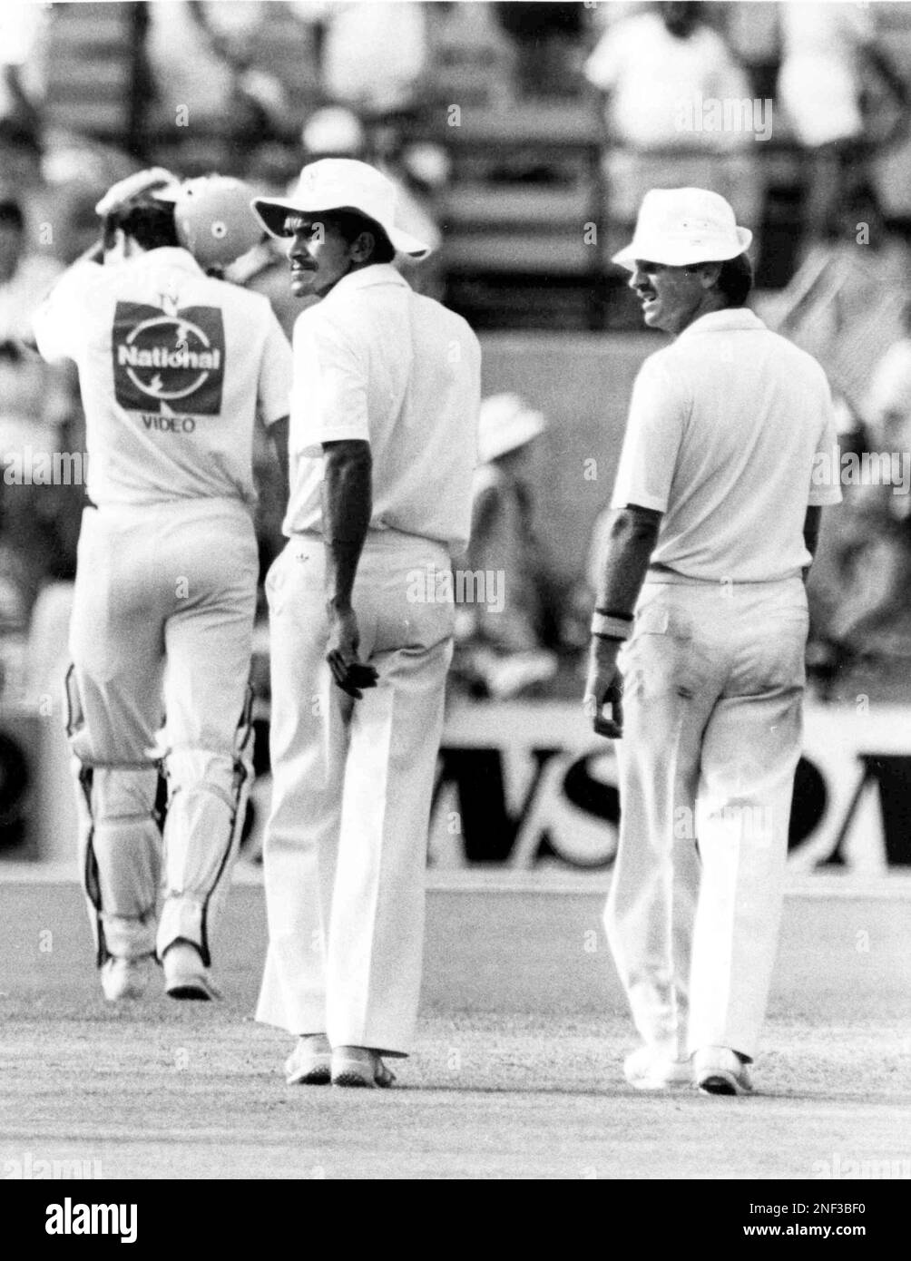 Omar Henry, centre, looks back at the Kingsmead pitch, Durban, on Jan ...