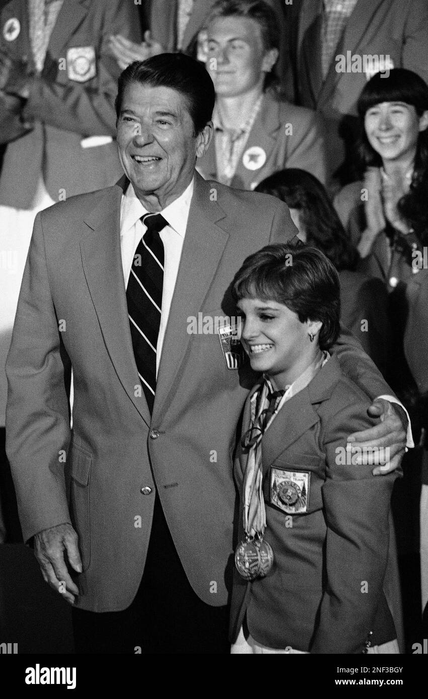 Pres. Ronald Reagan, left, receives a big hug from West Virginias Mary ...
