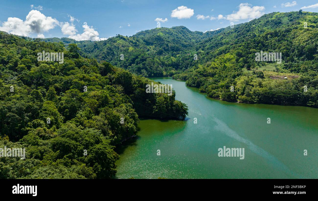 Aerial drone of lake among mountains with tropical forest. Lake Balanan ...