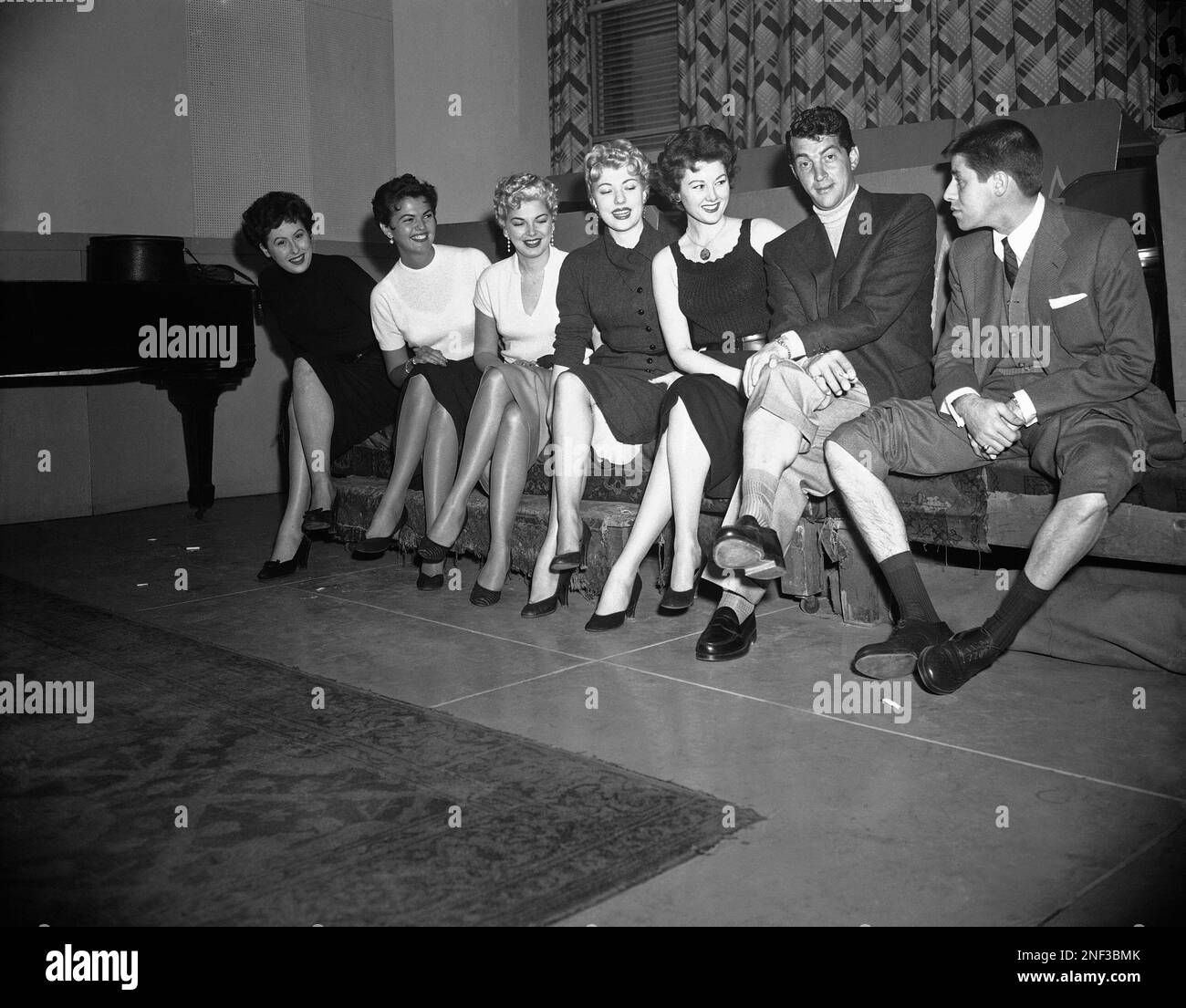 A group of pretty dancers relax after a tryout for a part in the club ...