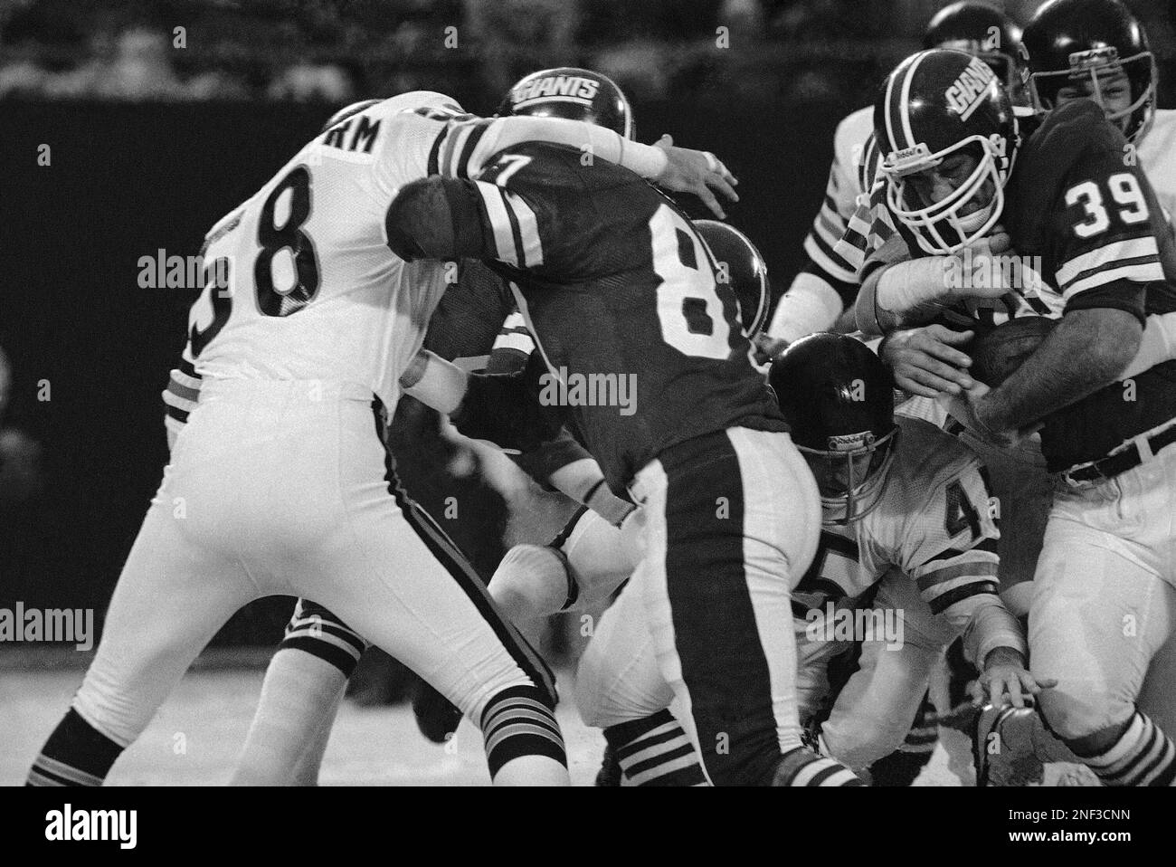 Larry Csonka of the New York Giants finds an arm around his neck as he ...