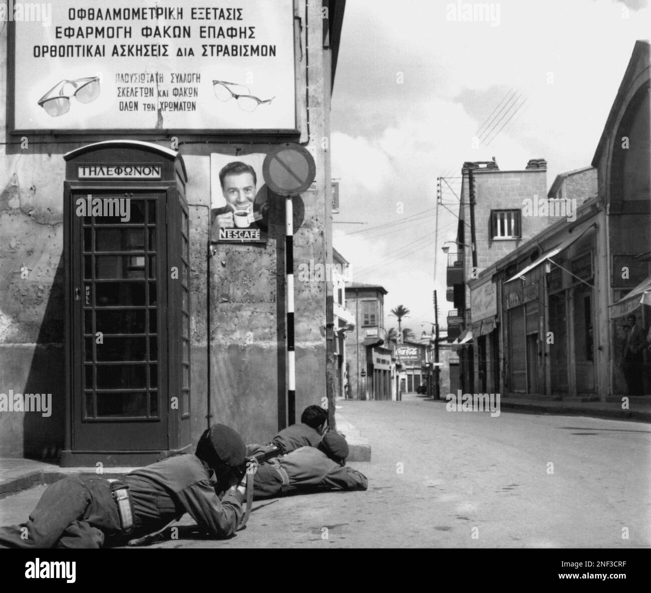 Greek Cypriot police take up positions facing the Turkish quarter on ...
