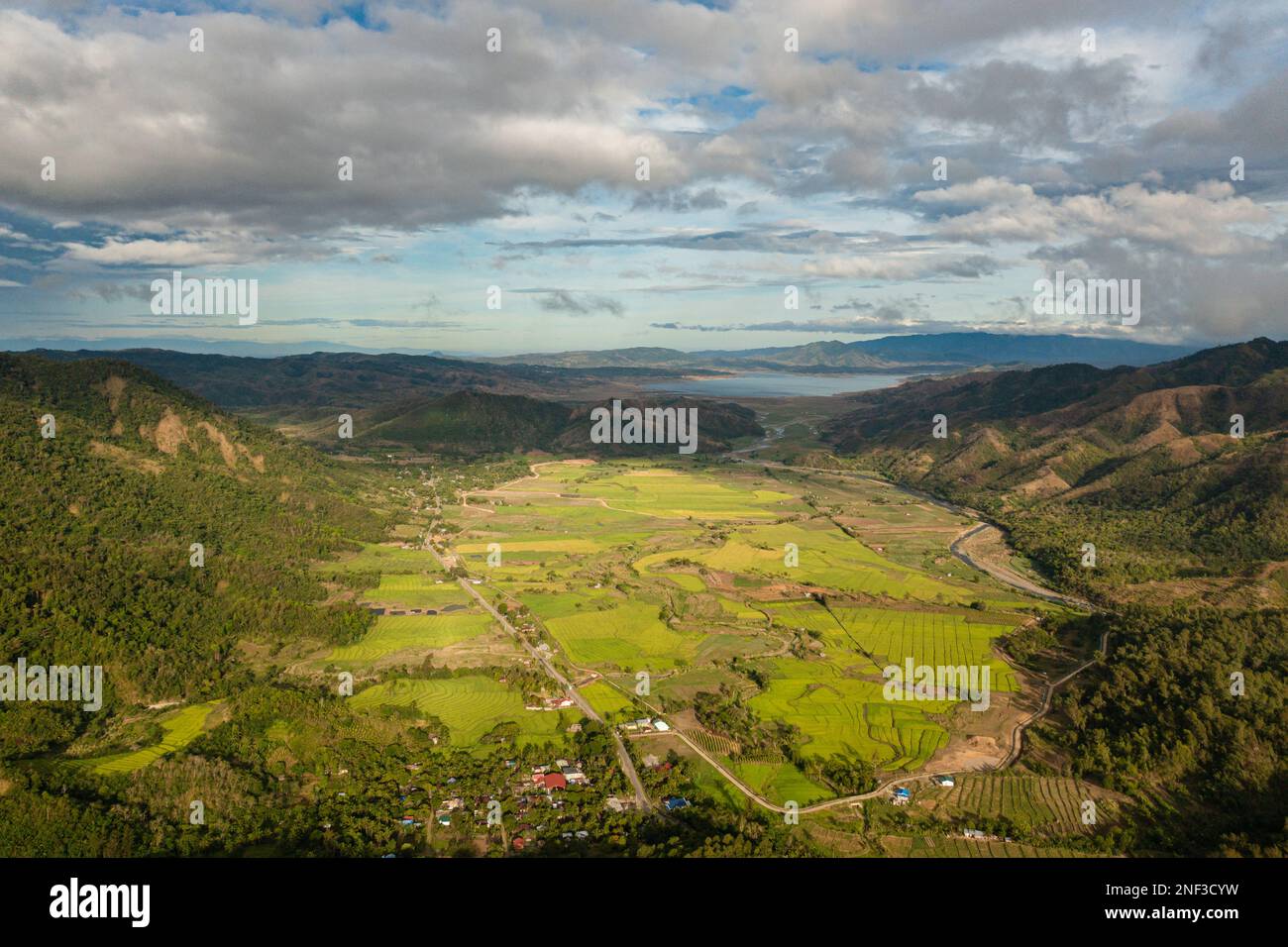 Mountain slopes with rainforest and a mountain valley with farmland ...