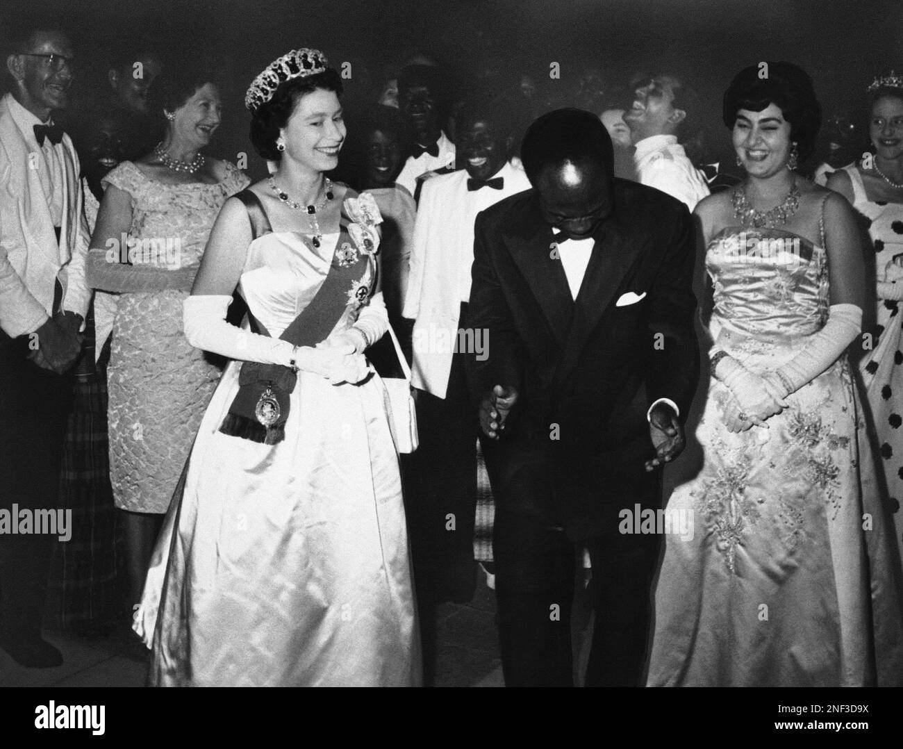 Queen Elizabeth II and other guests laugh as President Kwame Nkrumah of ...