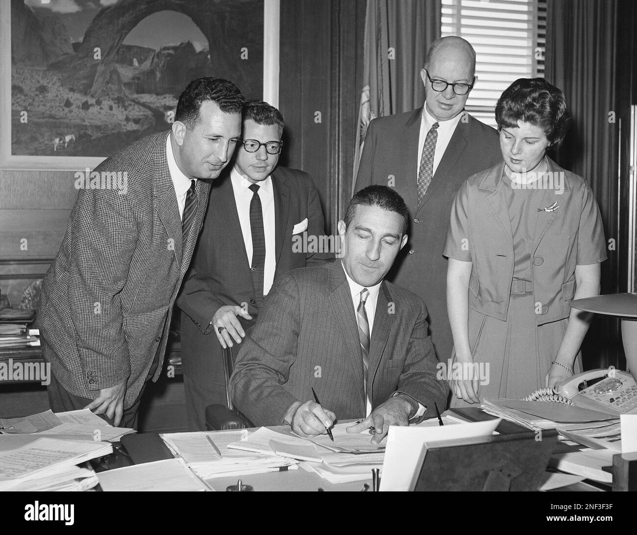 Secretary of Interior Stewart Udall signs a deed to 55 acres of land to ...