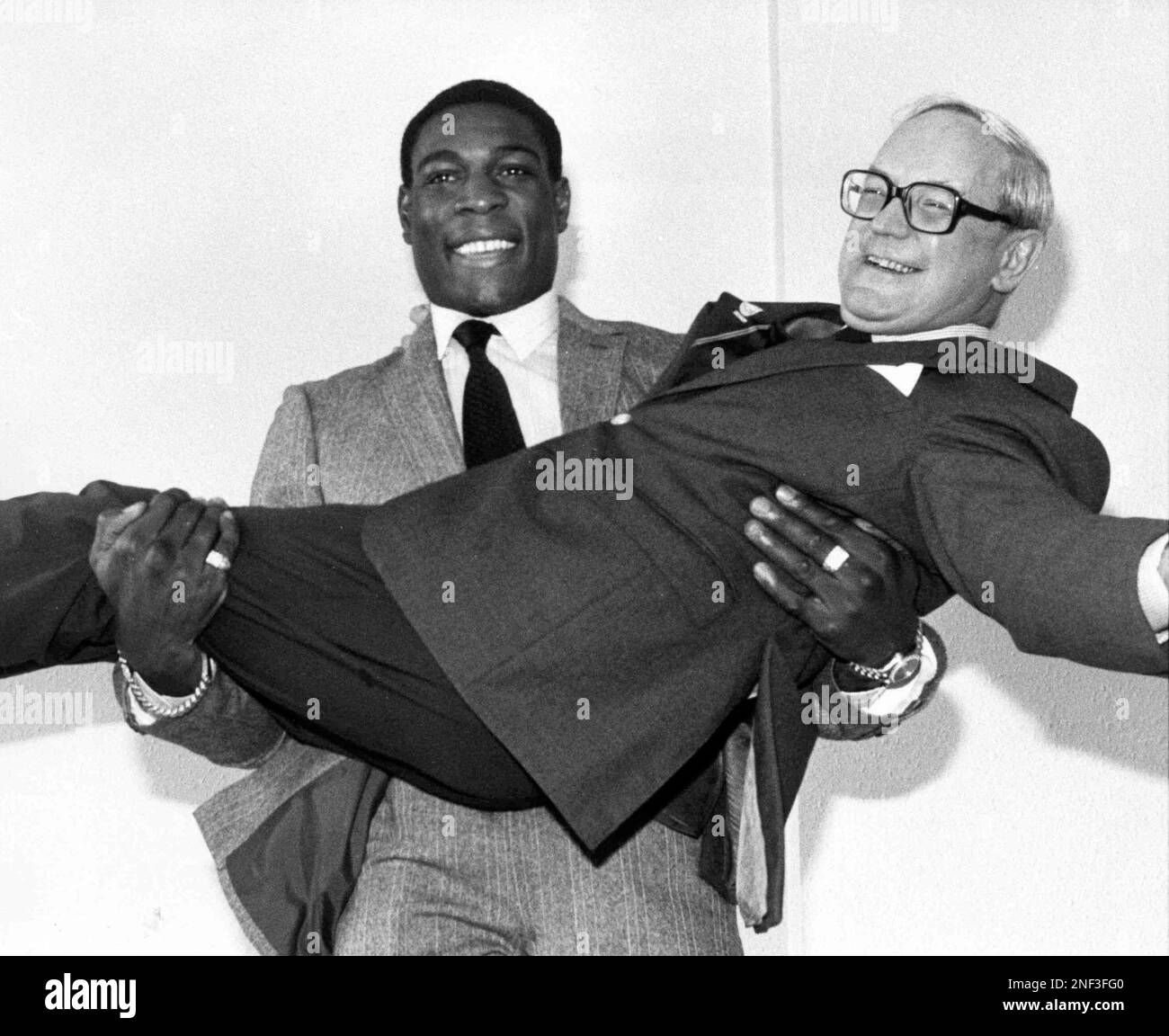 Britain's heavyweight boxer Frank Bruno lifts his friend, BBC Sports ...