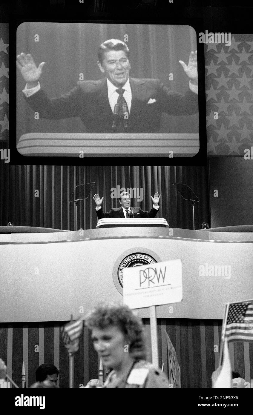 President Ronald Reagan gestures at the podium of the Dallas Convention ...