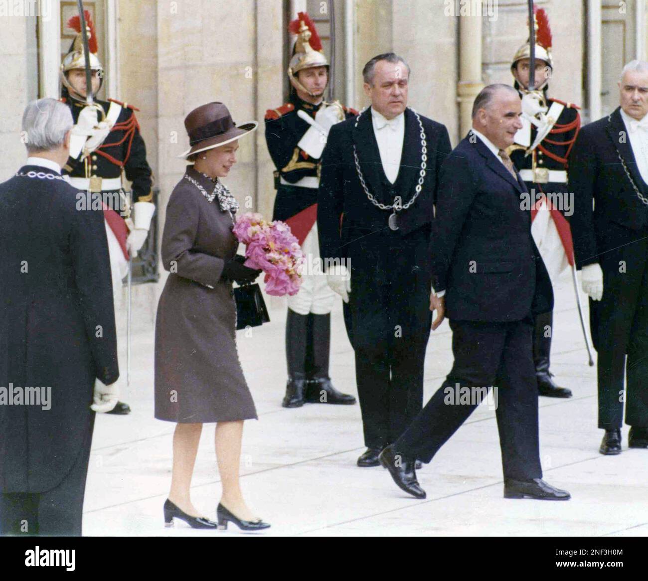 Britain's Queen Elizabeth II walks with French President Georges ...