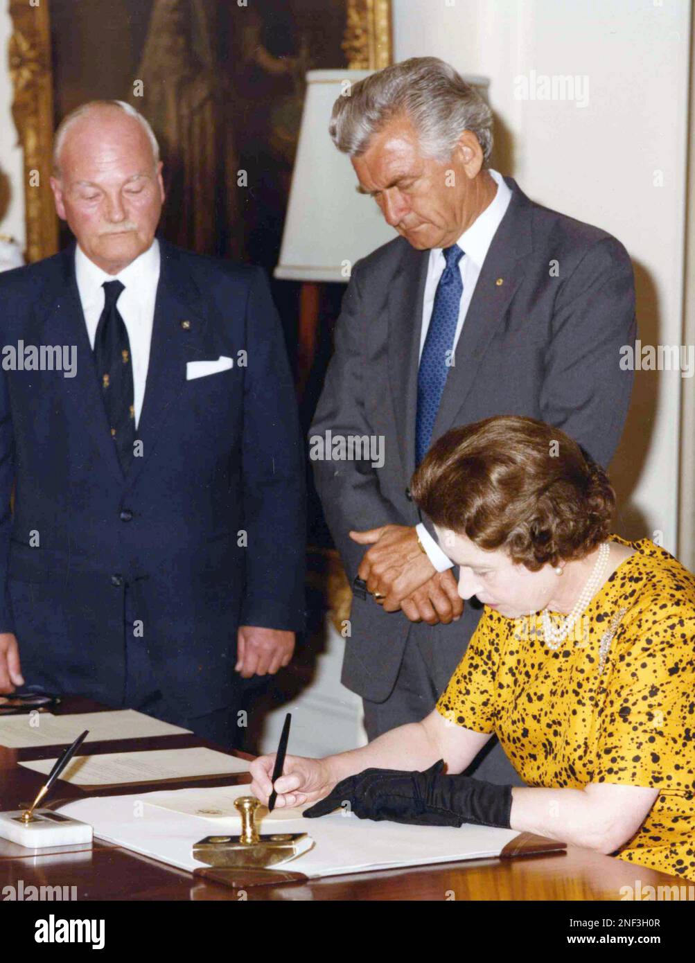 Britain's Queen Elizabeth II signs the Proclamation of the Australia ...