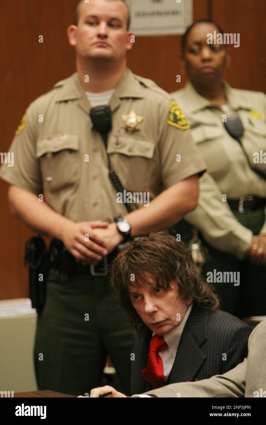 Music producer Phil Spector sits in a courtroom for his sentencing in ...