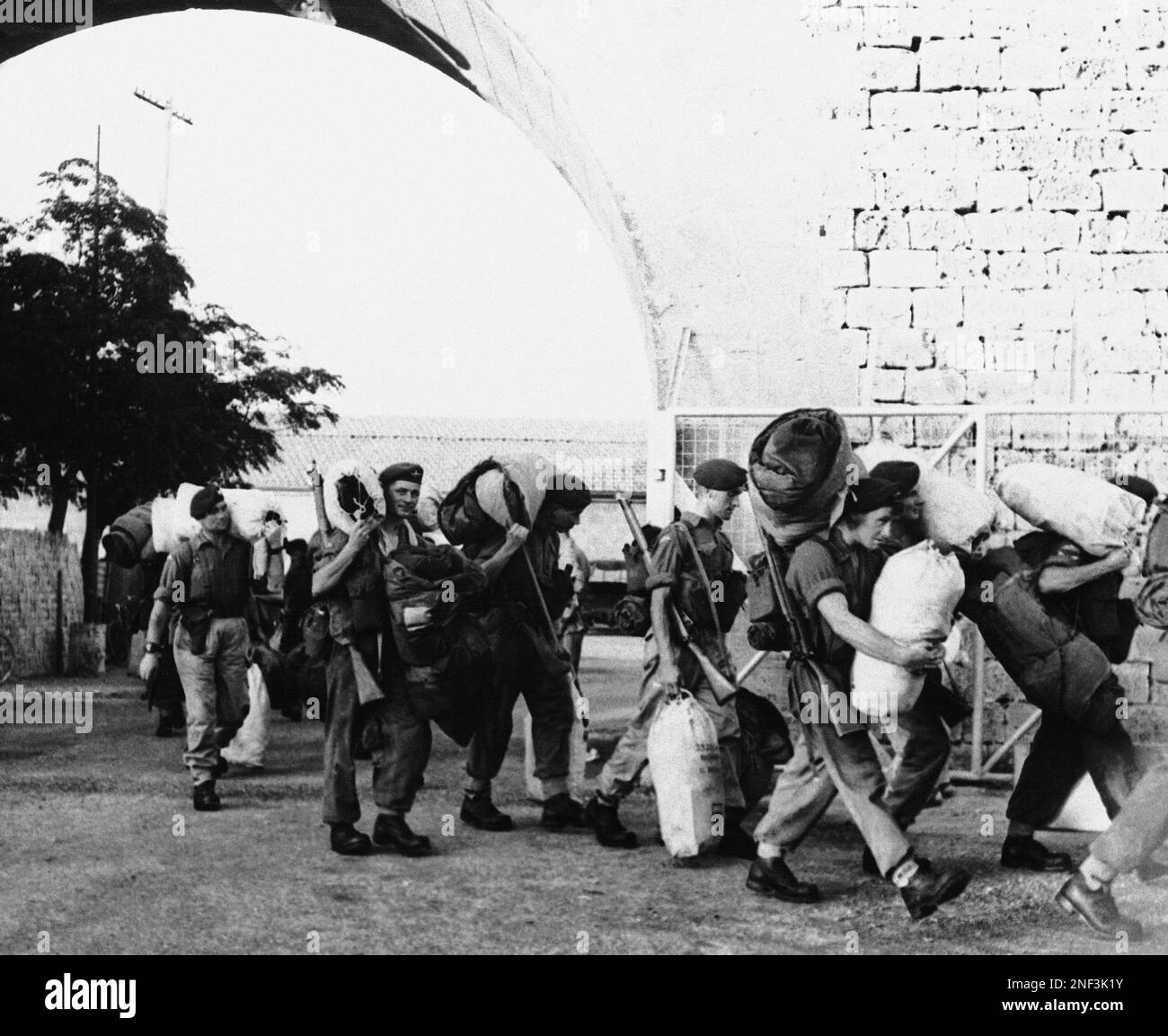 British reinforcements reach Cyprus carrying rifles and their personal ...