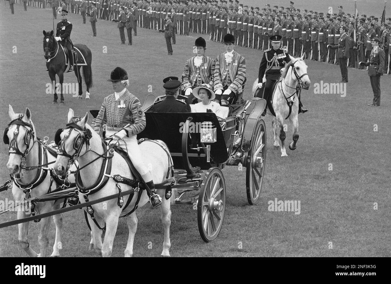 Britain's Queen Elizabeth II is seen in an open coach during an ...