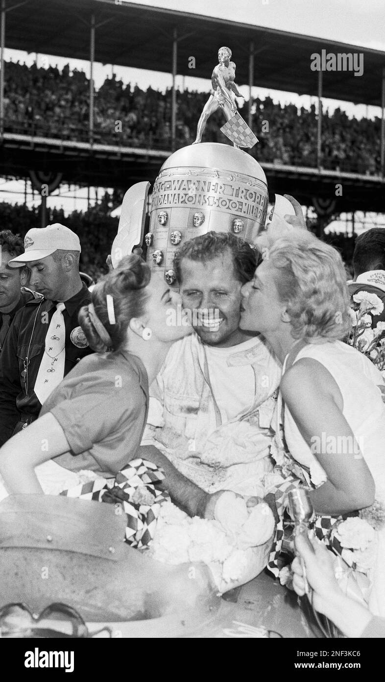 Bob Sweikert happily receives kisses from his wife, Dolores, left, and ...