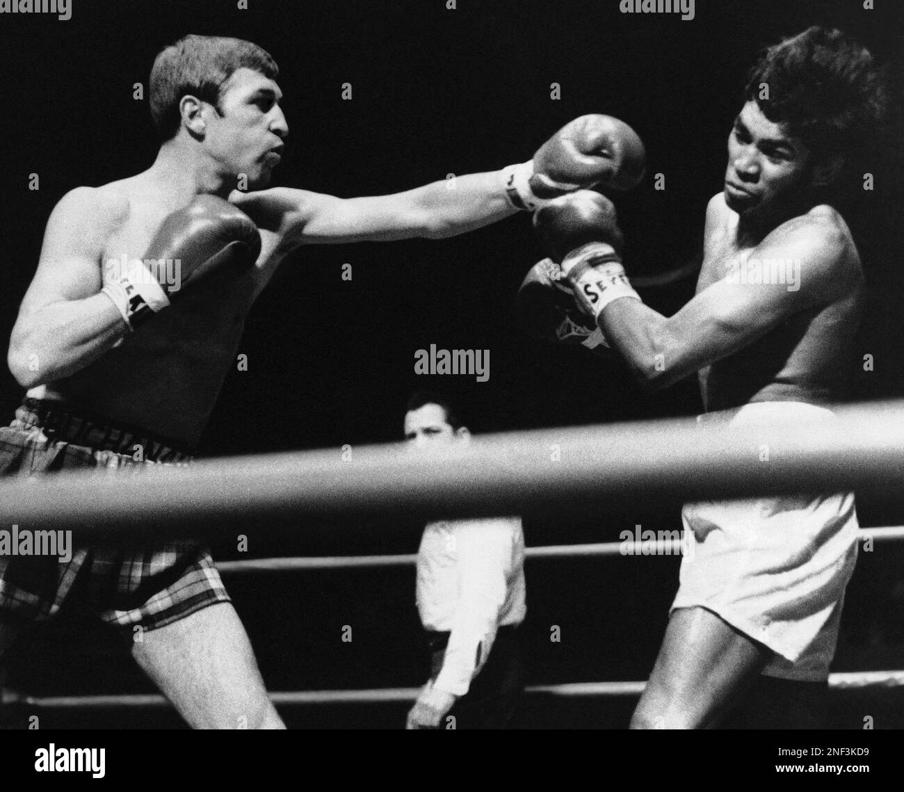 World lightweight champion Ken Buchanan,left, of Scotland, misses with ...