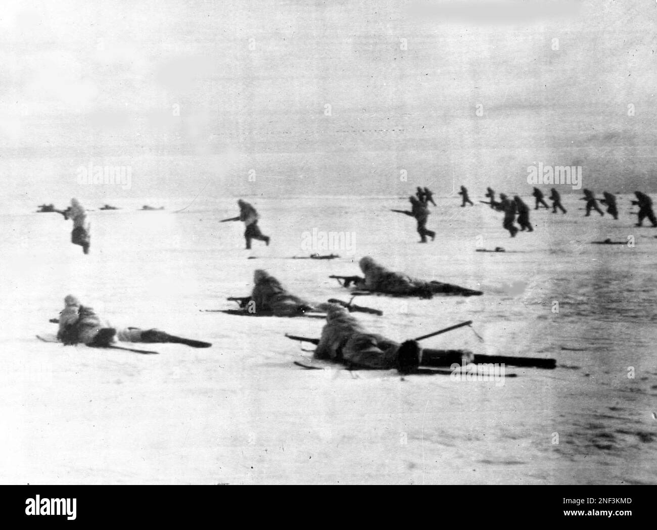 Soviet white-clad ski troops and other Red Army soldiers advance ...