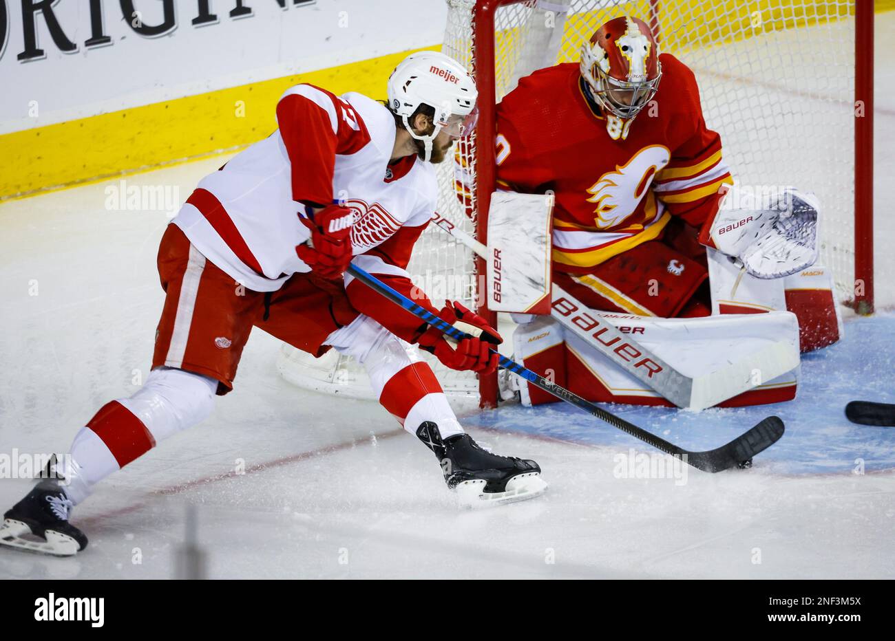 Detroit Red Wings forward Michael Rasmussen, left, tries to score ...