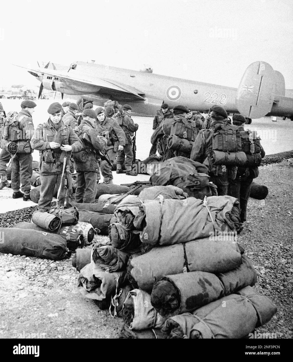 British paratroopers stand with their gear on an airfield at Nicosia ...
