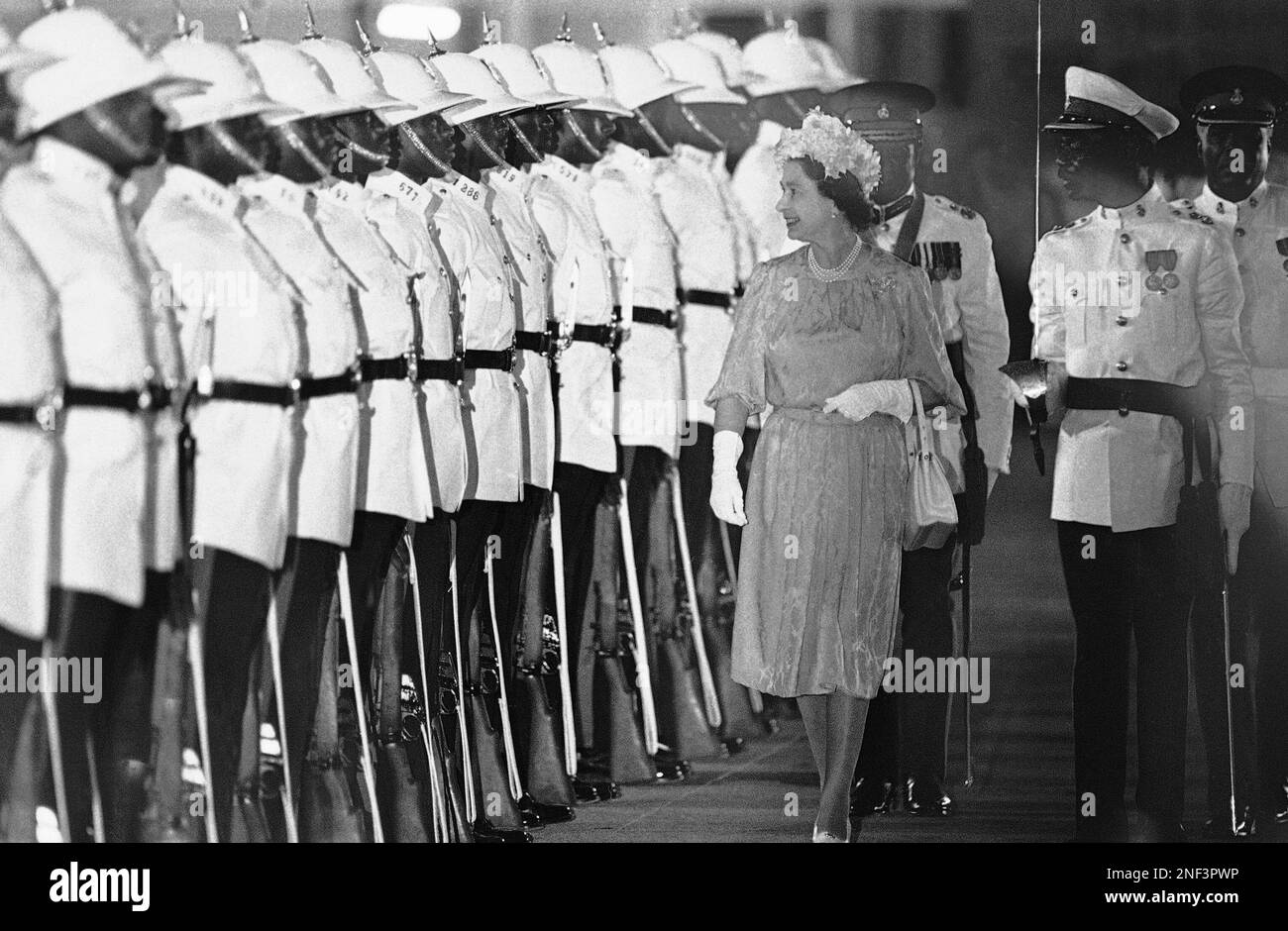 Her Majesty Queen Elizabeth smiles as she reviews the Nassau Police on ...