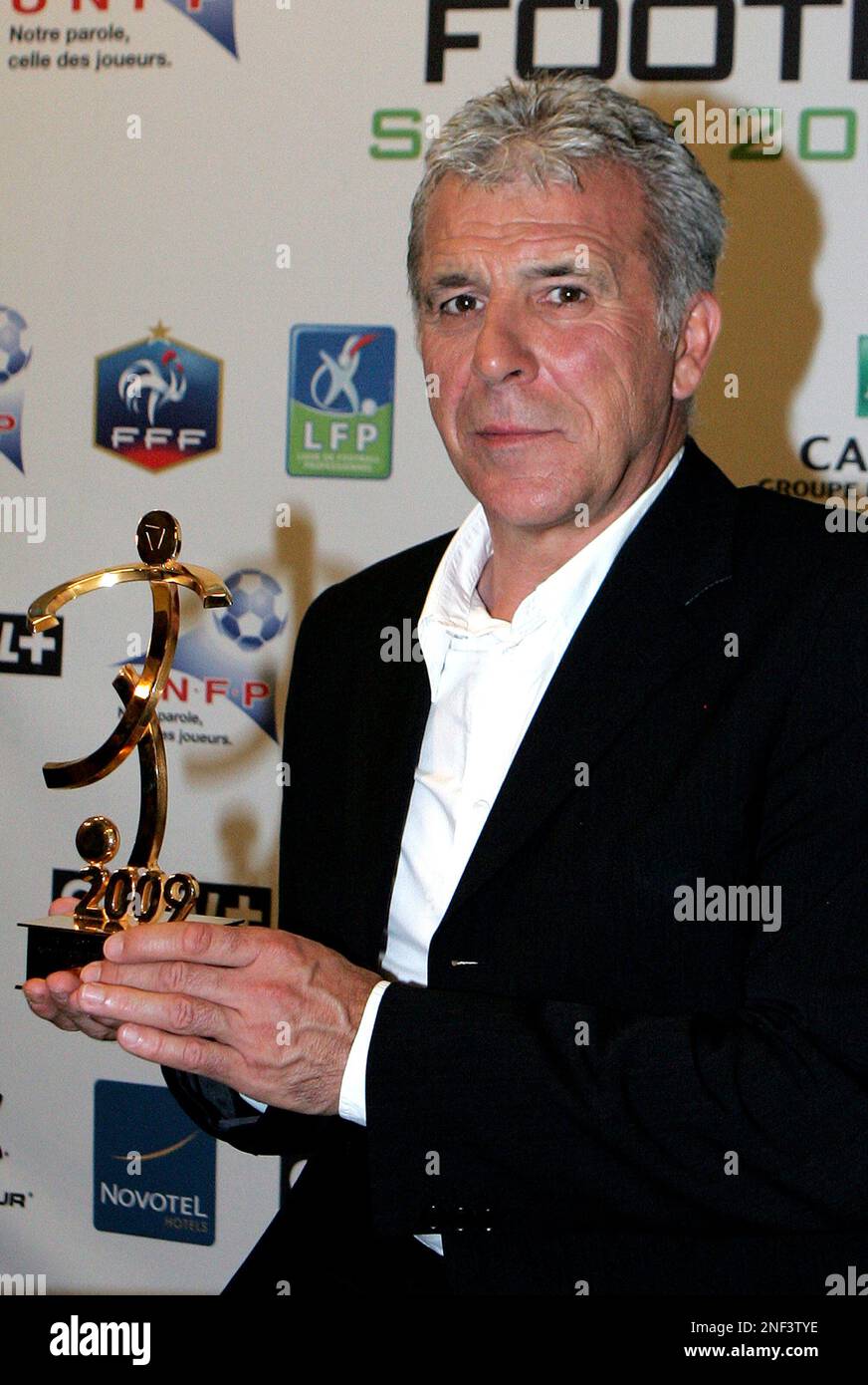 Belgian soccer coach Eric Gerets of Marseille holds his trophy for the ...