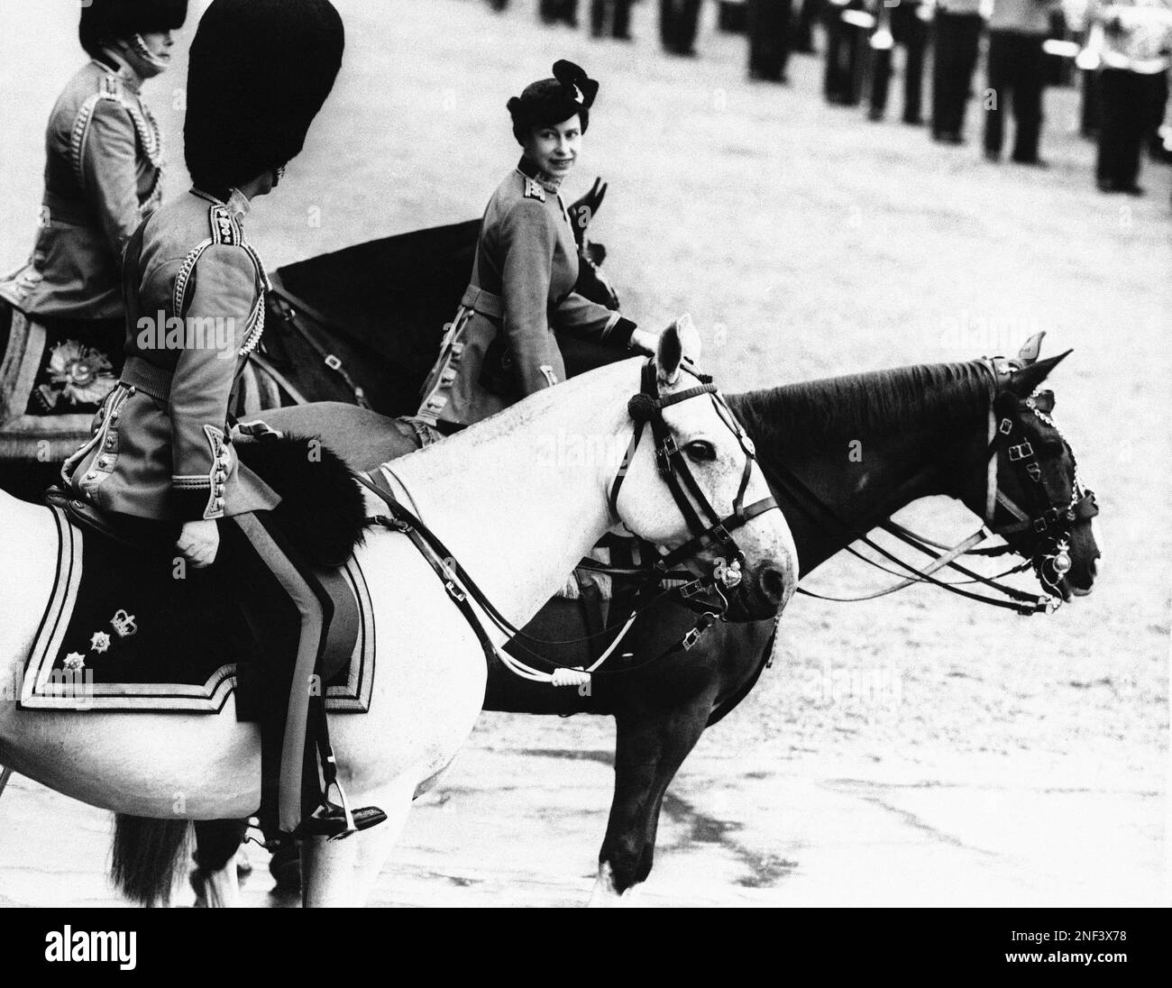 Britain's Queen Elizabeth II, sitting side-saddle on a police horse ...