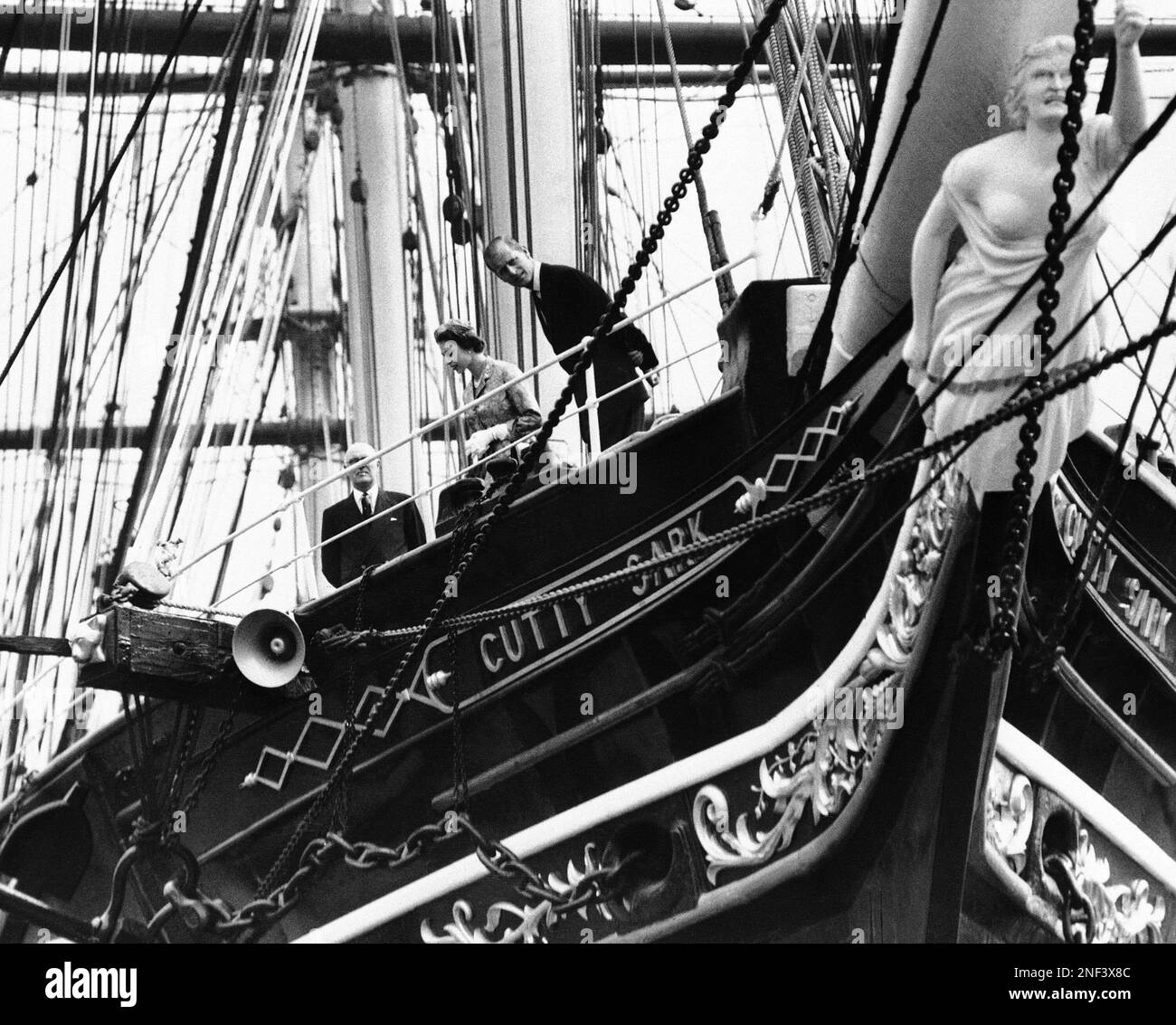 A maze of ropes and chains frame Queen Elizabeth II of the England and ...