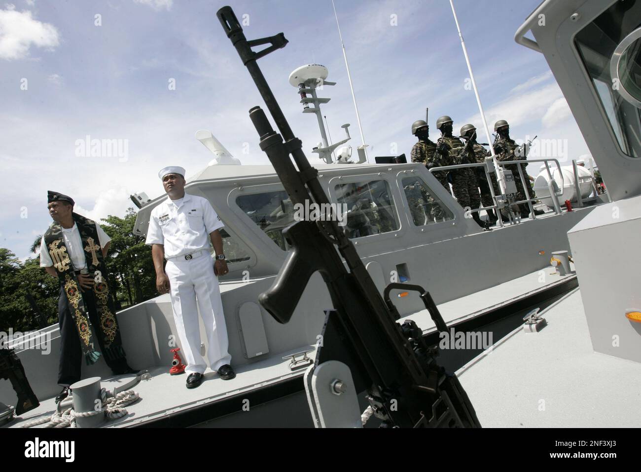 Philippine Navy SEALS stand in formation on the deck of one of three ...