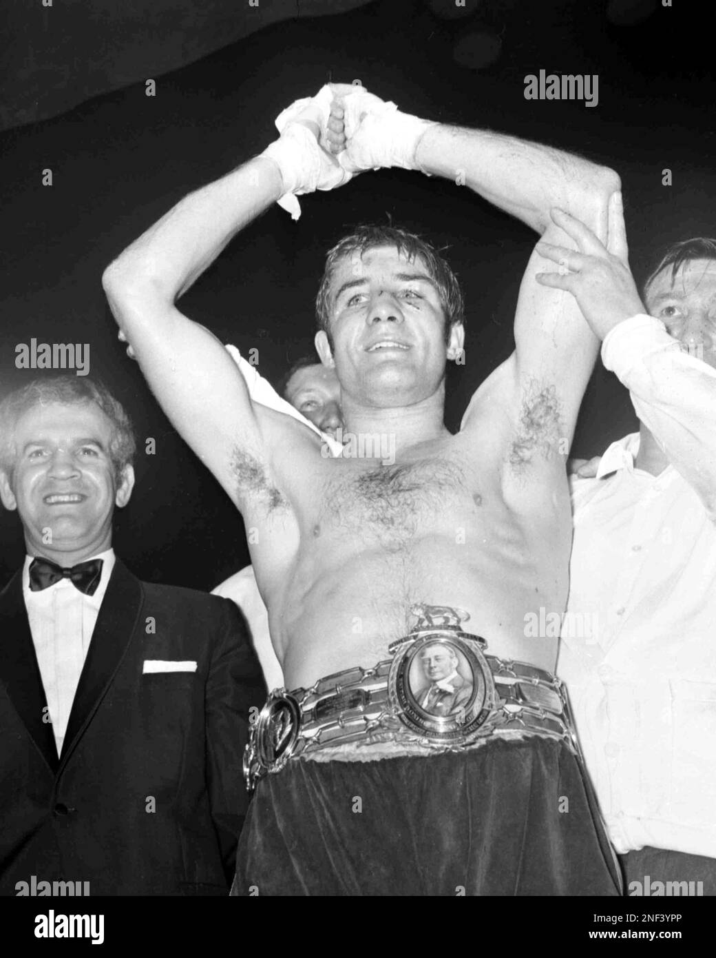 Britain's Mark Rowe, wearing the Lonsdale Belt, acknowledges the cheers ...