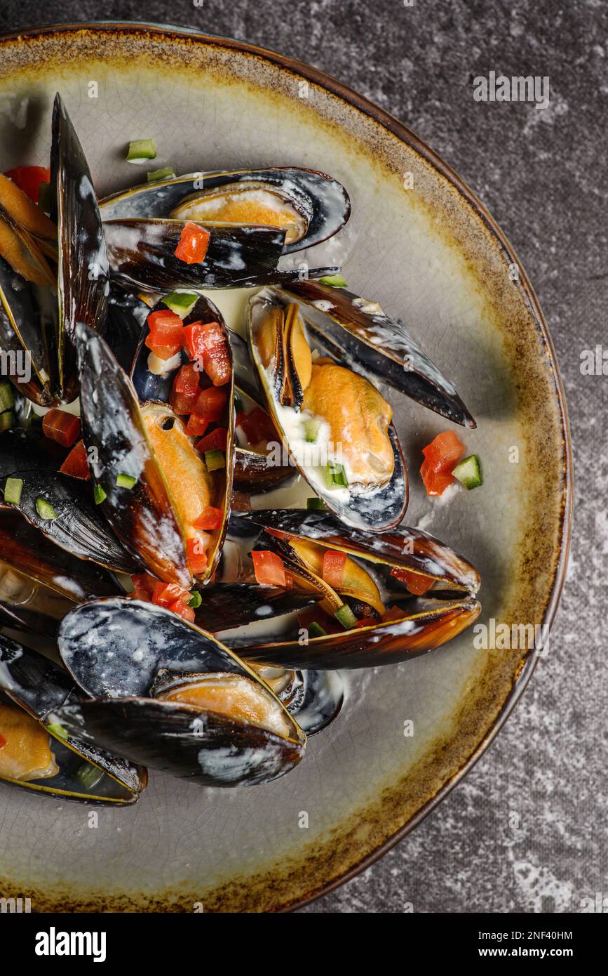 mussels with shells in tomato sauce. High quality photo Stock Photo - Alamy
