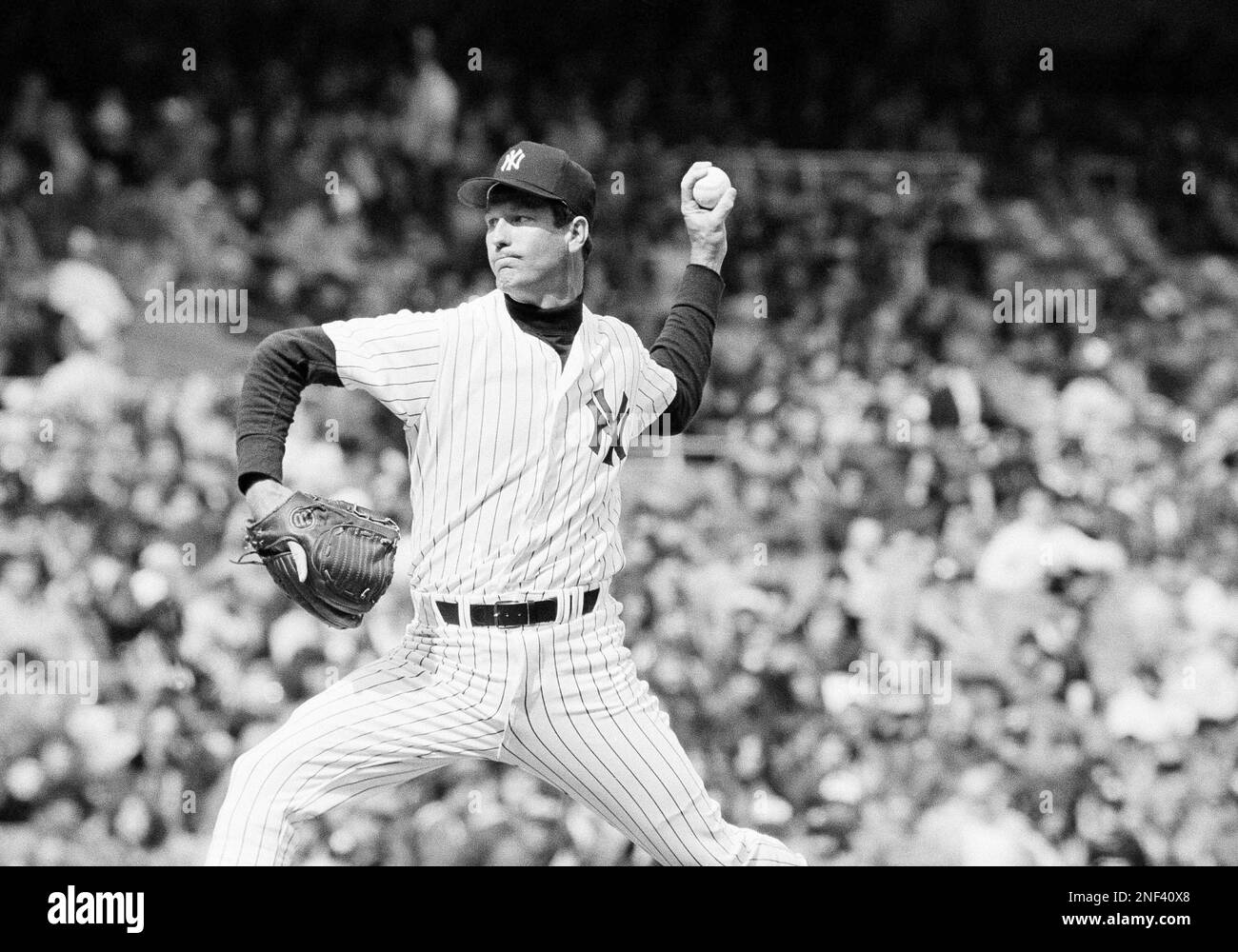 New York Yankee's pitcher Tommy John is shown in action on the mound ... New York Yankee's pitcher Tommy John is shown in action on the mound ...