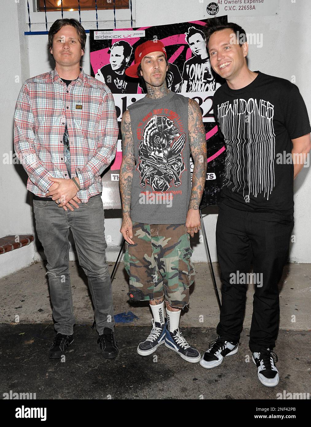 From left to right, musician Tom DeLonge, drummer Travis Barker, and ...
