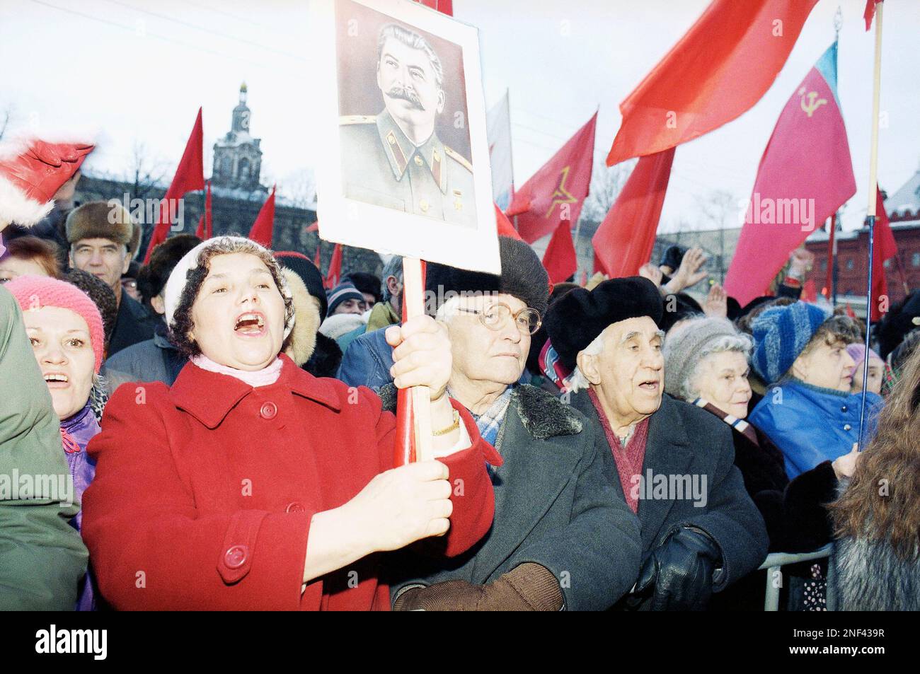 Hardliners, one holding a portrait of Soviet dictator Josef Stalin ...