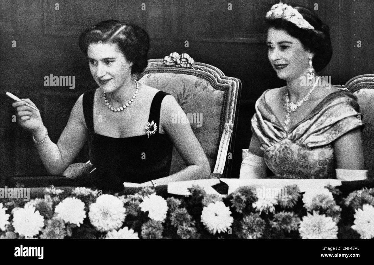 Britain's Queen Elizabeth II (right), puts aside cares of state as she ...