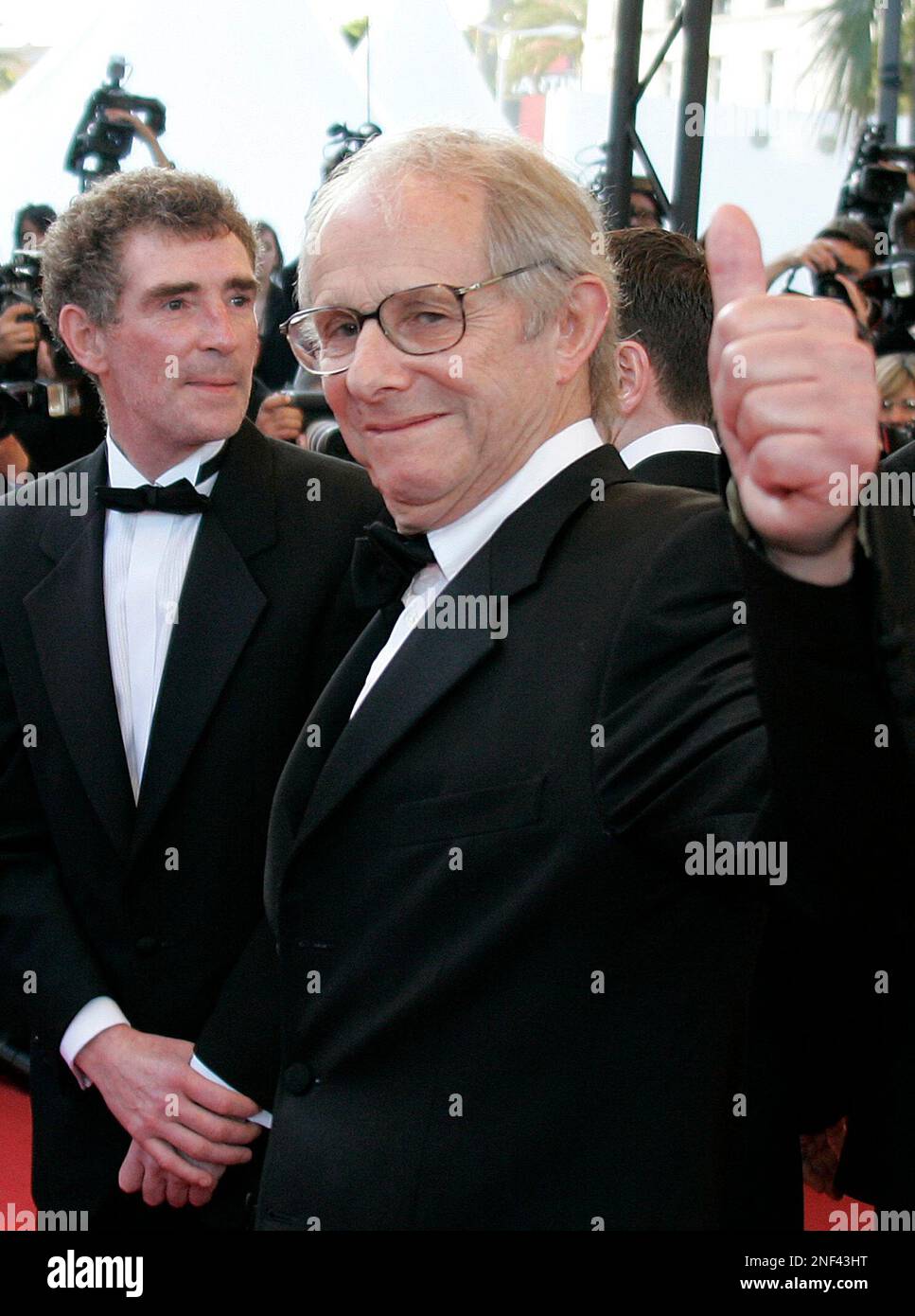 British Director Ken Loach, right, gives the thumbs up as British actor ...