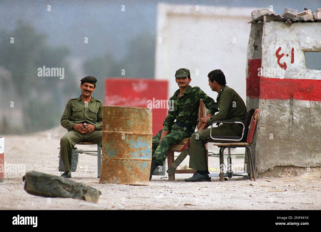 Iraqi soldiers man a checkpoint in Um Qasr, Iraq, Friday, March 22 ...