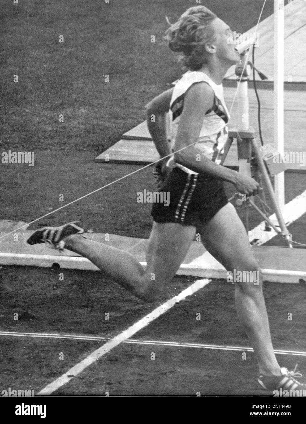 Australia's Betty Cuthbert crosses finish line to win the Olympic women ...