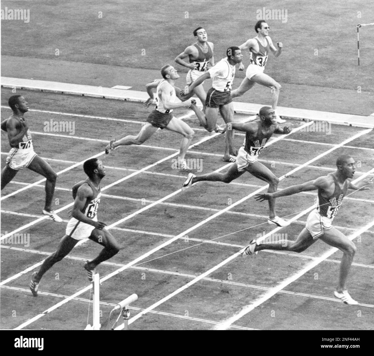 Henry Carr of USA, cuts the tape to win the men's 200-meter final at the National Stadium in ...