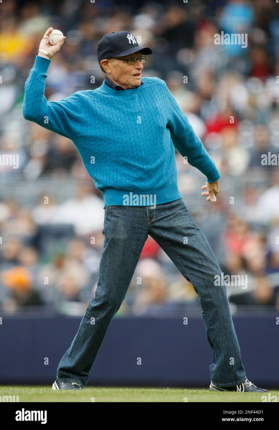 Television show host Larry King throws out the ceremonial first pitch ...
