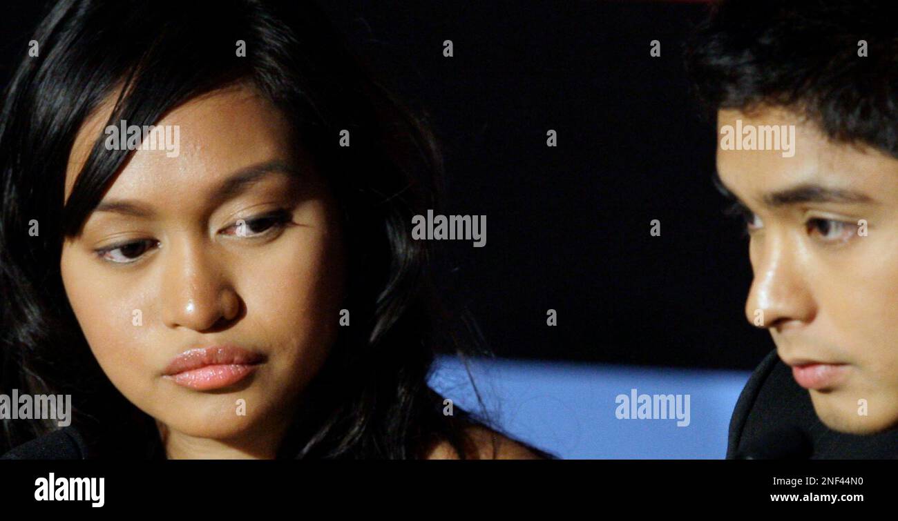 Filipino actors Mercedes Cabral, left, and Coco Martin listen to ...