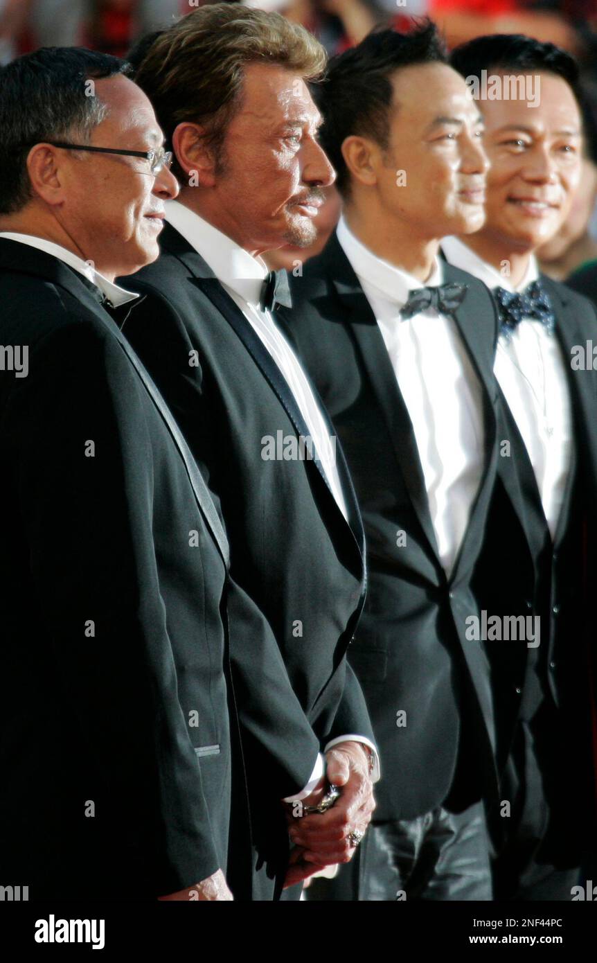 Chinese director Johnnie To, left, French actor Johnny Hallyday, second ...