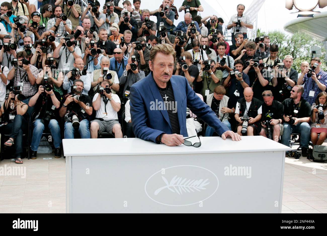 French actor and singer Johnny Hallyday poses during a photo call for ...