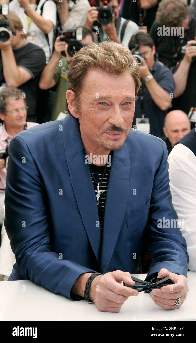 French actor and singer Johnny Hallyday poses during a photo call for ...