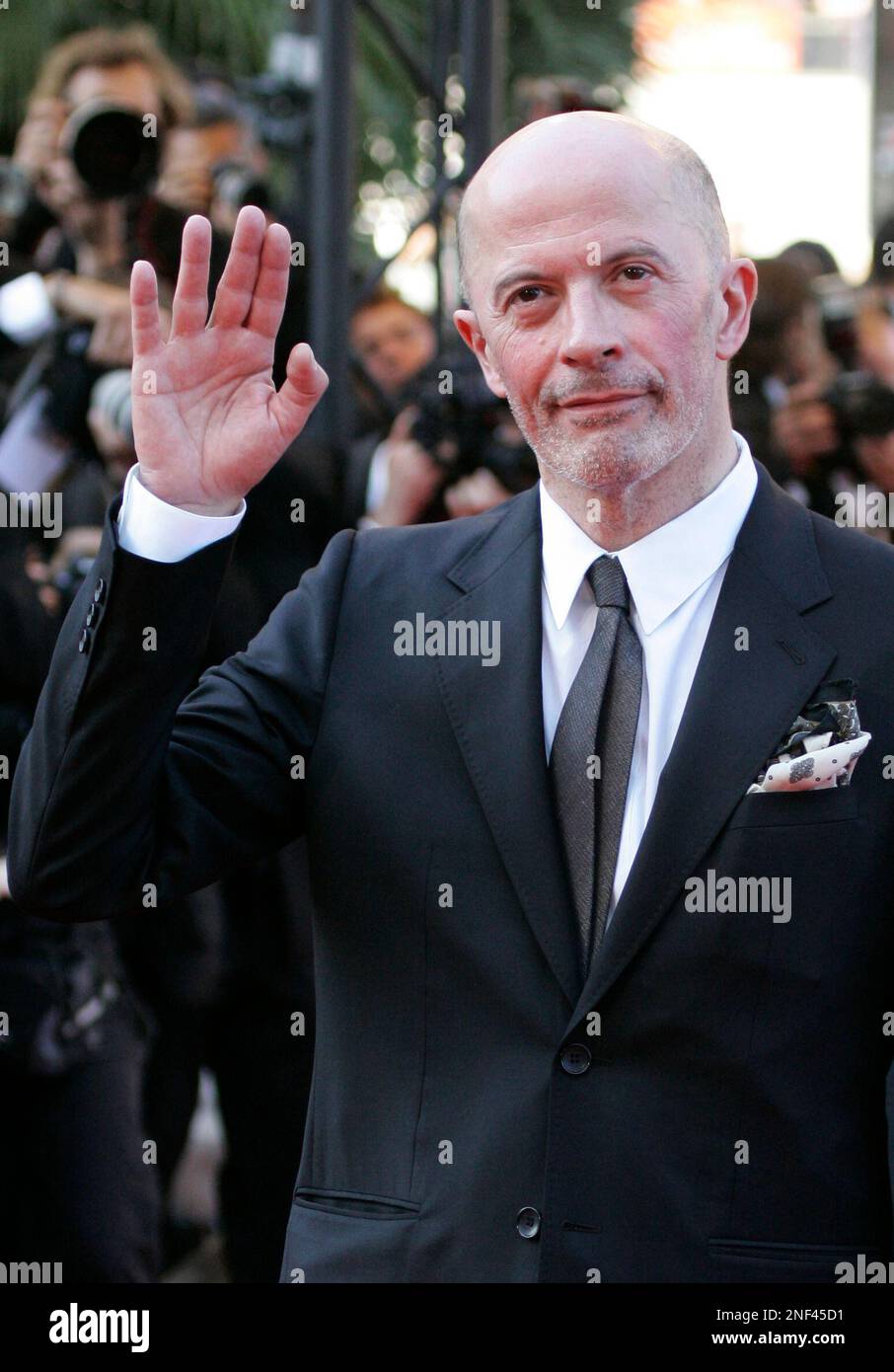 French director Jacques Audiard waves as he arrives for the screening ...